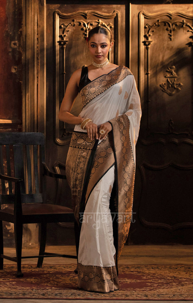 Striking White Katan Silk Saree With A Black Border & Gold Buttas ...